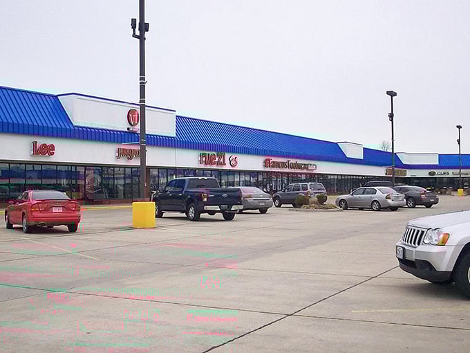 The main strip of Sikeston Factory Outlet Stores showcases familiar brands like Lee, FILA, and Famous Footwear under that distinctive blue trim.