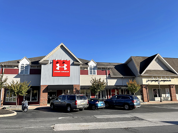 The colonial-inspired architecture of Under Armour's storefront blends historical charm with modern retail therapy at impressive discounts.