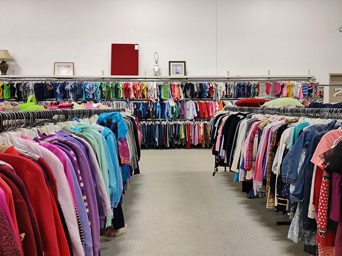 Rainbow rows of possibility! Value World's clothing section stretches into the distance like a technicolor treasure map waiting to be explored.