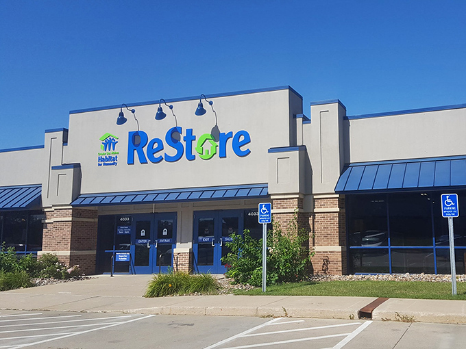 The blue and green ReStore sign beckons like a siren call to bargain hunters. Your wallet's happy place awaits inside these unassuming brick walls.