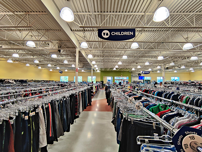 The children's section sign hovers above an ocean of carefully organized clothing. Even kids who outgrow things faster than Minnesota weather changes will find their match here.
