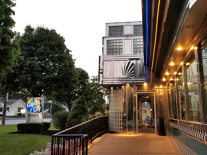 The classic exterior of Capital City Diner, with its vintage sign and gleaming chrome, looks like a time capsule you can actually eat in.