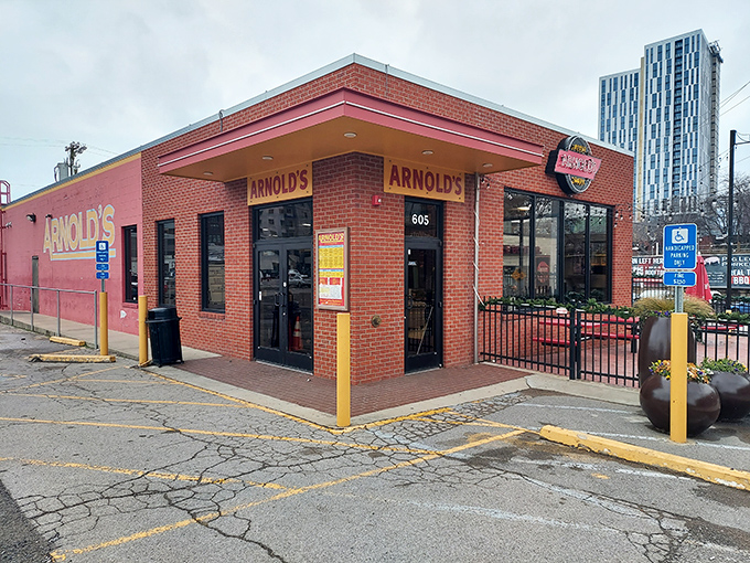 Arnold's brick exterior stands like a culinary lighthouse against Nashville's modern skyline, promising comfort food salvation to hungry souls.