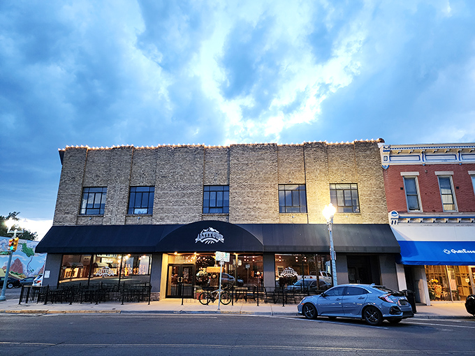 Downtown Laramie's brick beauty stands proudly against Wyoming's dramatic sky, promising culinary adventures that rival the scenery outside.