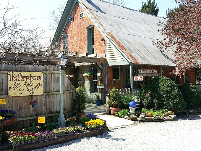 Winter's chill can't diminish the warmth radiating from this brick farmhouse, where the "OPEN" sign promises refuge and the flower beds hint at seasons of beauty to come.