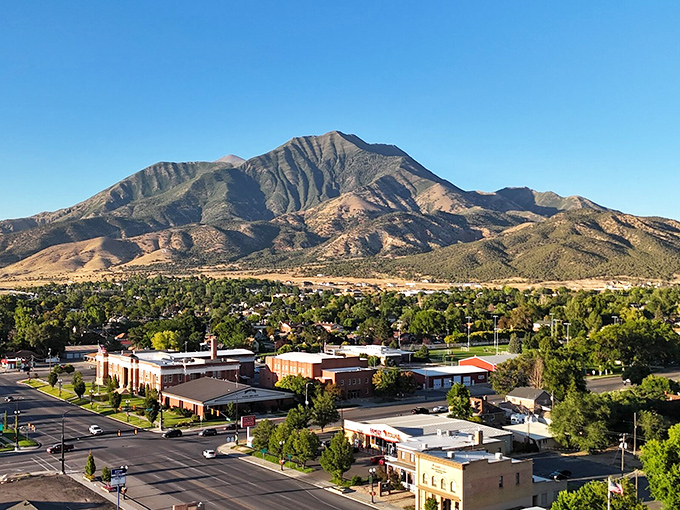 Mount Nebo stands like a watchful guardian over Nephi, its rugged peaks framing the town's charming downtown.
