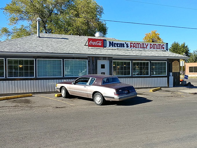The iconic Norm's Family Dining exterior stands proudly under Idaho's blue sky, a beacon for hungry locals seeking affordable comfort food.