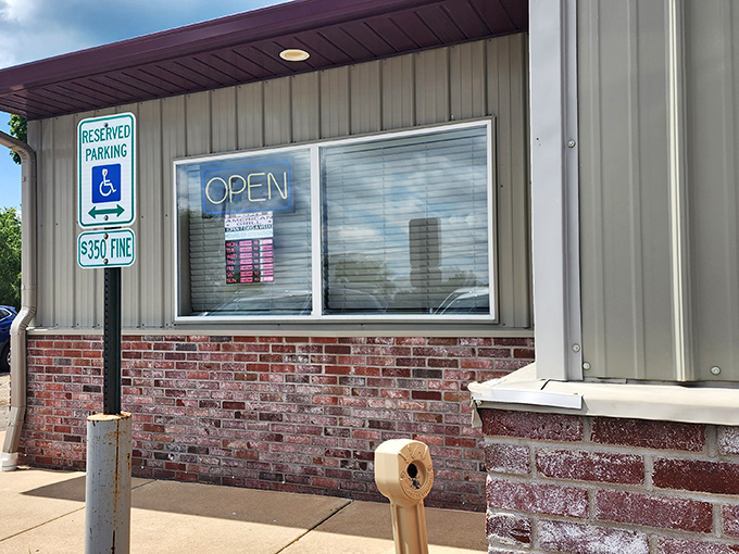 The neon "OPEN" sign glows like a beacon of hope for hungry travelers seeking honest food at honest prices in a world of $20 burgers.