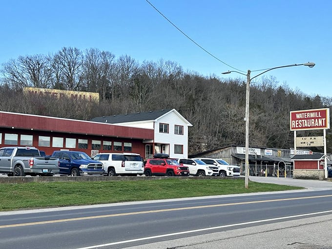 The Watermill's distinctive red exterior and classic sign beckon travelers from the highway, promising homestyle comfort food worth stopping for.