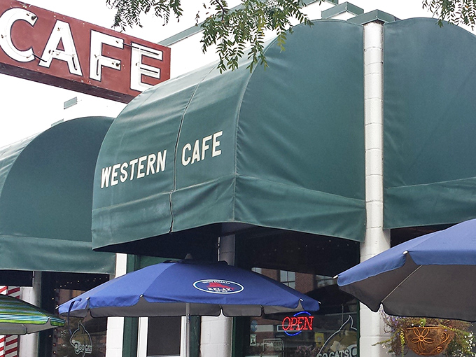 The iconic green awning of Western Caf&eacute; stands as a beacon of breakfast hope on Bozeman's Main Street, promising authentic Montana dining without pretension.