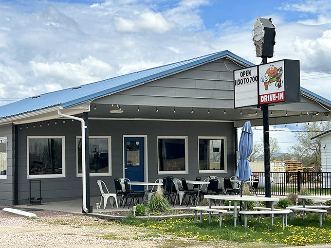That blue metal roof has sheltered generations of burger lovers seeking refuge from both hunger and interstate monotony.