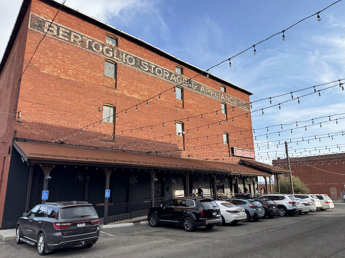 The historic brick exterior of Casagranda's Steakhouse, where string lights create an inviting atmosphere against Butte's industrial backdrop.