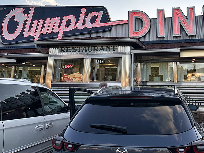 The classic stainless steel exterior of Olympia Diner whispers tales of late-night conversations, first dates, and countless cups of coffee that have warmed hands and hearts alike.