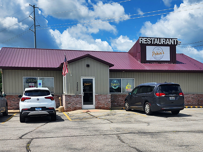 The burgundy roof of Pekin's American Grill stands out against the Illinois sky like a beacon for hungry travelers seeking honest food at honest prices.