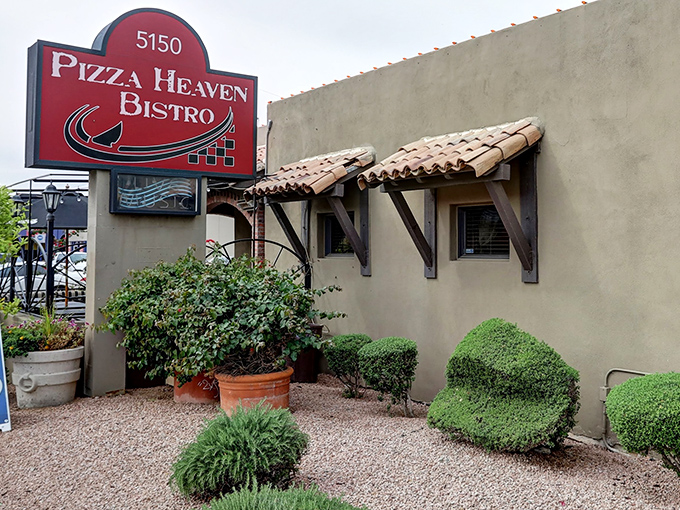 That iconic red sign beckons hungry travelers like a lighthouse guiding ships to safe, delicious harbor.