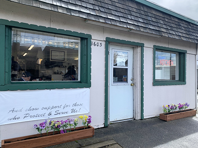 The unassuming exterior of Mom's Kitchen in North Bend might not scream "culinary destination," but those flower boxes hint at the homestyle magic happening inside. Like finding a Michelin-worthy meal in your favorite aunt's kitchen.