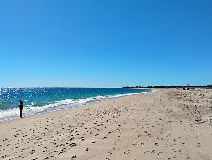 Paradise found! East Beach stretches before you like nature's welcome mat, where footprints in the sand become your only social media update.