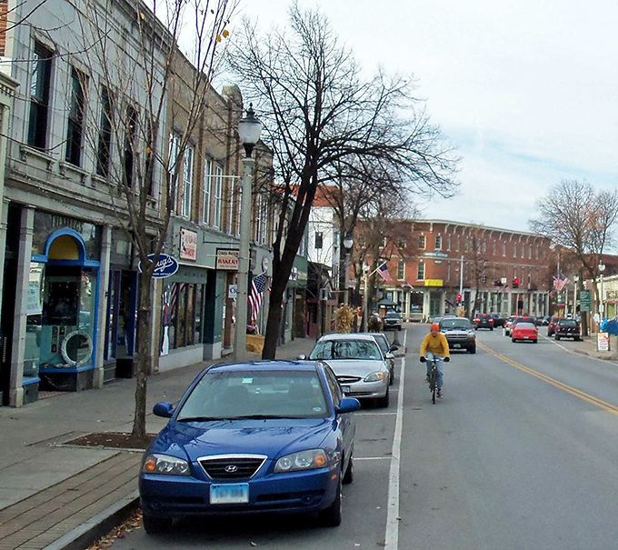 Downtown Bennington's historic facades tell stories older than your favorite vinyl records. Brick buildings and American flags create that perfect small-town rhythm.