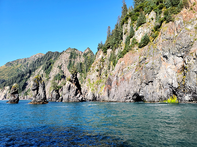 Dramatic cliffs plunge into crystal waters, where every turn reveals nature's version of showing off without even trying.