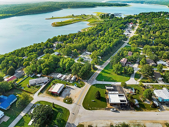 Aerial paradise! Diamond City nestles between emerald forests and Bull Shoals Lake's sapphire waters, proving that Mother Nature plays favorites in the Ozarks.