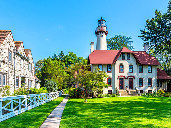 The Grosse Point Lighthouse stands like a maritime sentinel from another era, its red-roofed keeper's house whispering tales of Lake Michigan's moody waters.
