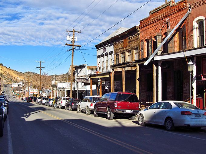 Virginia City's C Street &ndash; where the wooden sidewalks still creak with secrets and every storefront seems frozen in a sepia-toned photograph.