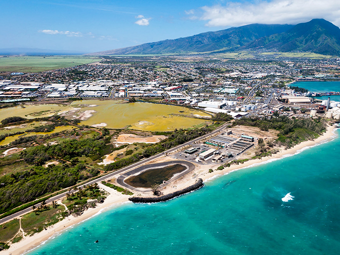 Where turquoise waters meet industrial practicality &ndash; Kahului's coastline offers that rare glimpse of paradise with its sleeves rolled up.