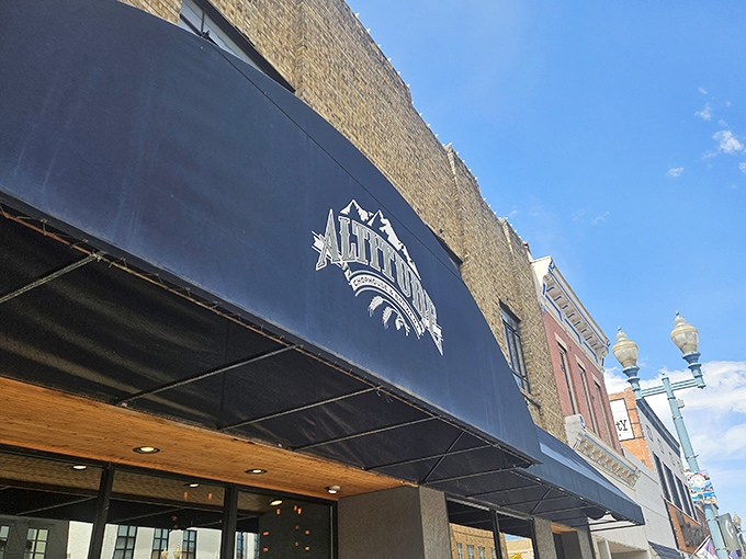 The classic brick fa&ccedil;ade of Altitude Chophouse stands proudly on Laramie's main drag, its navy awning like a culinary flag planted in Wyoming territory.