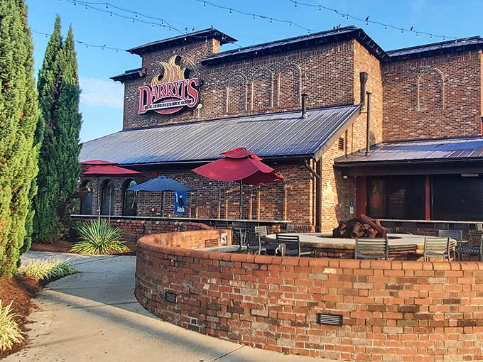 The brick fortress of flavor that is Darryl's Wood Fired Grill stands ready to welcome hungry pilgrims. Those red umbrellas aren't just for show&mdash;they're signaling deliciousness ahead.