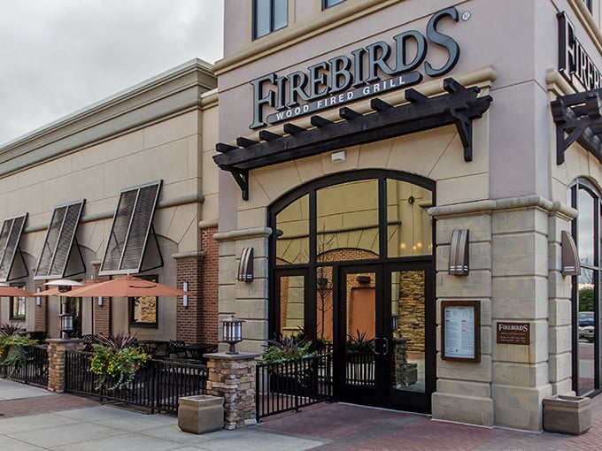 The iconic Firebirds exterior beckons like a warm hearth on a cold Pennsylvania evening. Stone and wood elements hint at the flame-kissed delights waiting inside.