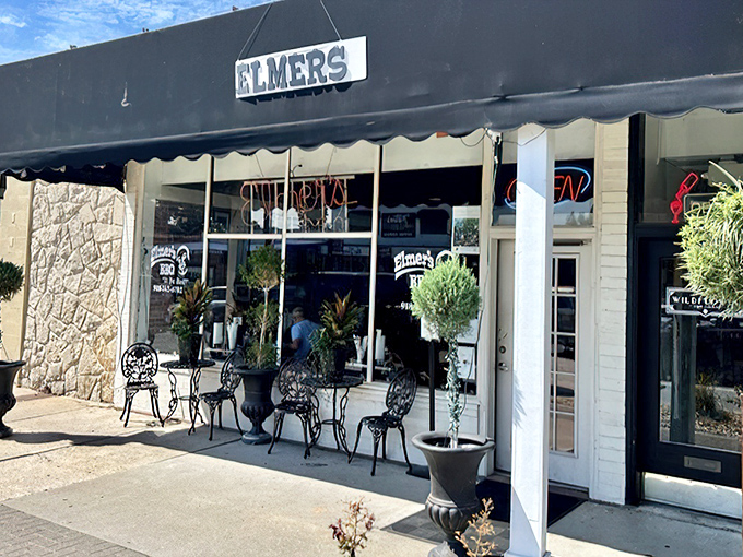 The unassuming storefront of Elmer's BBQ beckons with its simple black awning and wrought iron patio furniture&mdash;proof that great barbecue doesn't need fancy packaging.