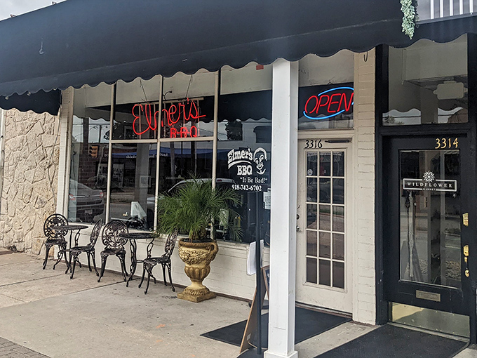 The unassuming storefront of Elmer's BBQ in Tulsa promises more with its "It Be Bad" slogan than its modest exterior suggests. BBQ paradise awaits behind those doors.