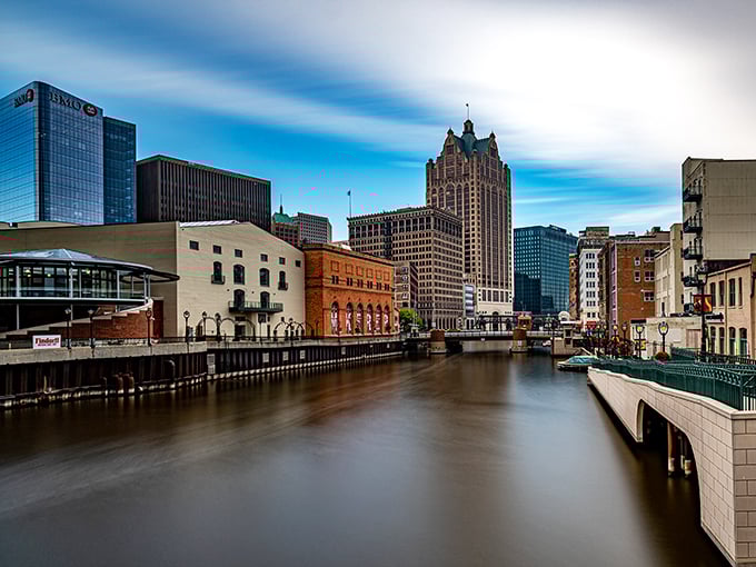 Milwaukee's skyline reflects in the river like a postcard that forgot to inflate its prices along with its reputation.