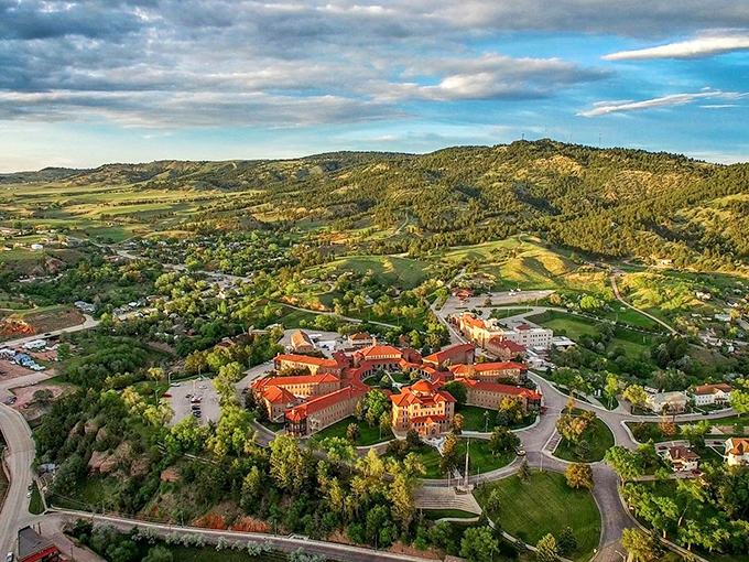 Aerial majesty! The historic buildings of Hot Springs nestle into the Black Hills landscape like terracotta treasures on nature's green velvet cushion.