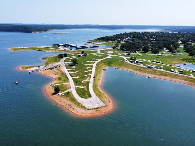 From above, Diamond City's peninsula resembles a painter's palette dipped in blues and greens, where roads curve gently between water and wilderness.