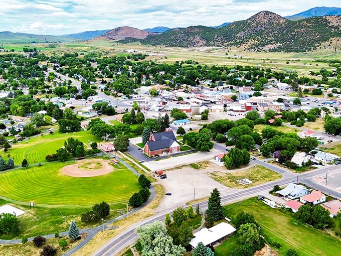 From above, Malad reveals its true character—a verdant oasis nestled against mountains that stand like ancient guardians of this peaceful valley.
