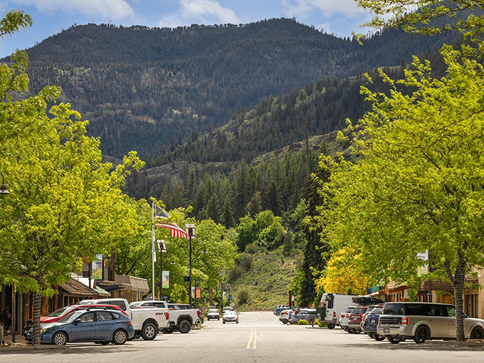 Main Street Twisp, where mountains stand guard like patient sentinels and the pace of life slows to match the gentle rhythm of the nearby rivers.