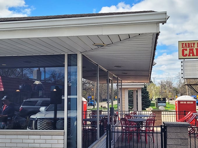 Red outdoor seating waits patiently for Michigan's warmer days, when breakfast al fresco becomes life's greatest luxury.