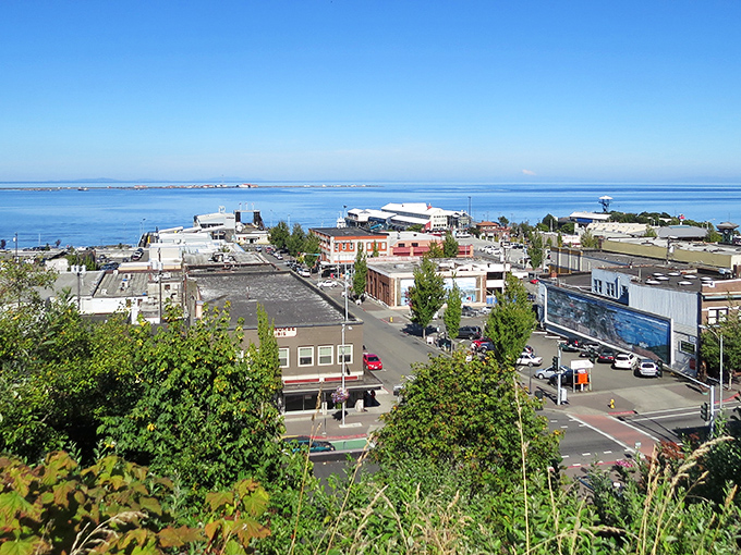 Port Angeles stretches toward the Strait of Juan de Fuca like a postcard come to life, where mountains meet maritime in perfect harmony.