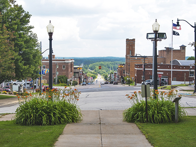 Main Street vista that proves small towns still know how to frame a view. Those day lilies aren't just pretty &ndash; they're determined.