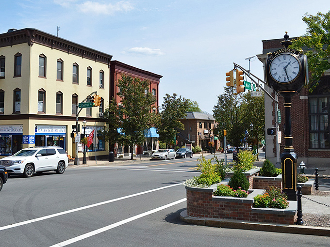 The iconic town clock stands sentinel at Madison's crossroads, keeping time for generations of locals who still believe in the magic of Main Street America.