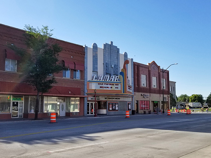 The historic Lamar Theatre's Art Deco façade isn't just preserved—it's thriving, offering first-run movies at prices that won't make your retirement account weep.
