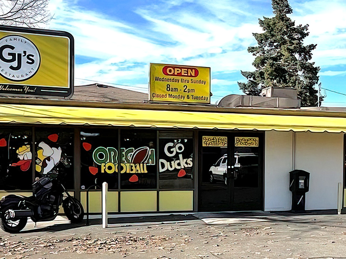 The classic diner exterior of GJ's proudly displays its Oregon Ducks spirit, where locals gather for pre-game fuel before cheering "Go Ducks!" at Autzen Stadium.
