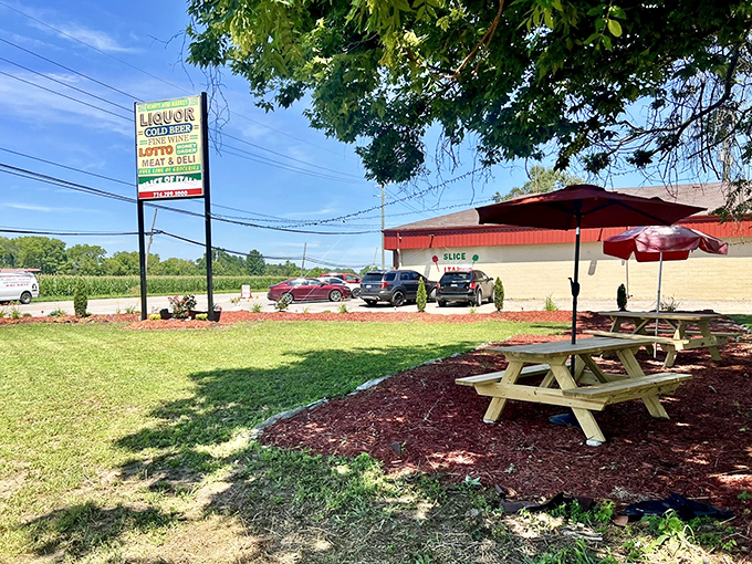 Picnic tables under umbrellas invite you to enjoy your massive slice in the Michigan sunshine. Pizza with a side of fresh air!