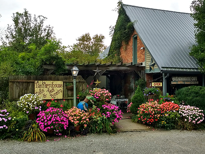Mother Nature herself seems to be the landscaper here, with an explosion of impatiens and petunias framing the entrance in a rainbow of blooms that practically shout "Come in and stay awhile!"