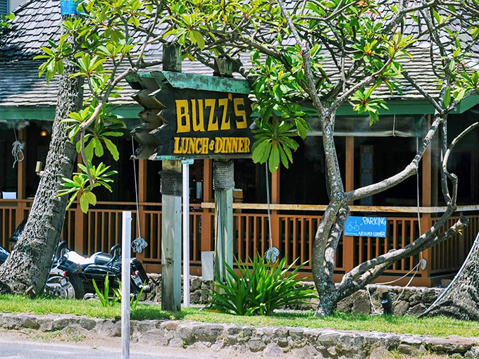 Buzz's iconic exterior welcomes you like an old friend, with mature trees providing natural shade for this beloved Kailua institution.