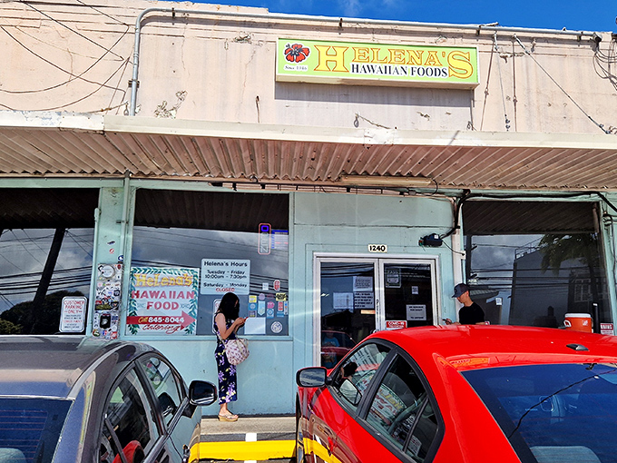 The unassuming exterior of Helena's Hawaiian Food stands like a culinary speakeasy &ndash; only the bright yellow sign hints at the treasures within.