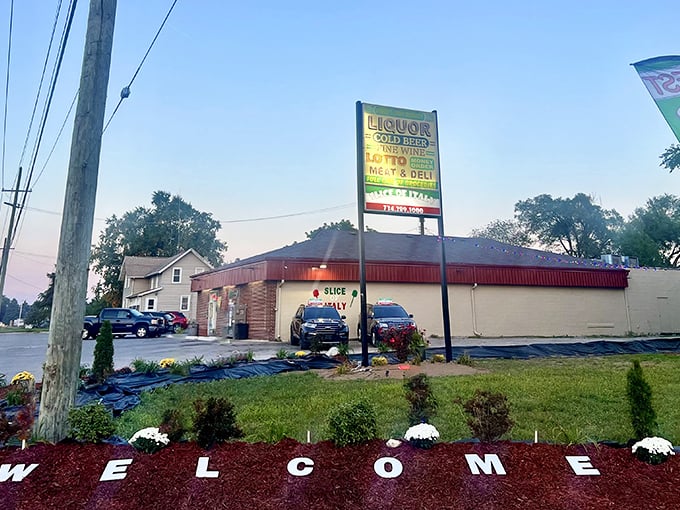 The roadside sign promises multiple delights, but we all know why you're really here. Pizza pilgrimage, commence!