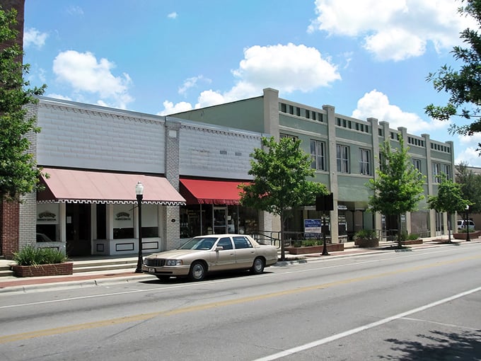Well-preserved commercial buildings showcase Bartow's architectural heritage, with colorful awnings providing shade for window shoppers along the main thoroughfare.