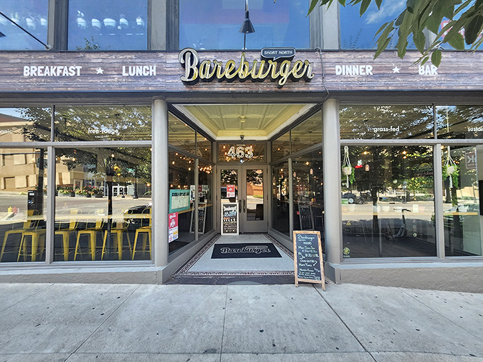 Bareburger's welcoming storefront in Columbus beckons with rustic charm and the promise of burger nirvana. The yellow chairs outside hint at sunny dining experiences to come.
